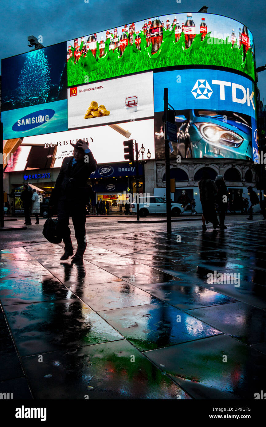 Rain reflects Piccadilly Circus lights in Central London Stock Photo ...
