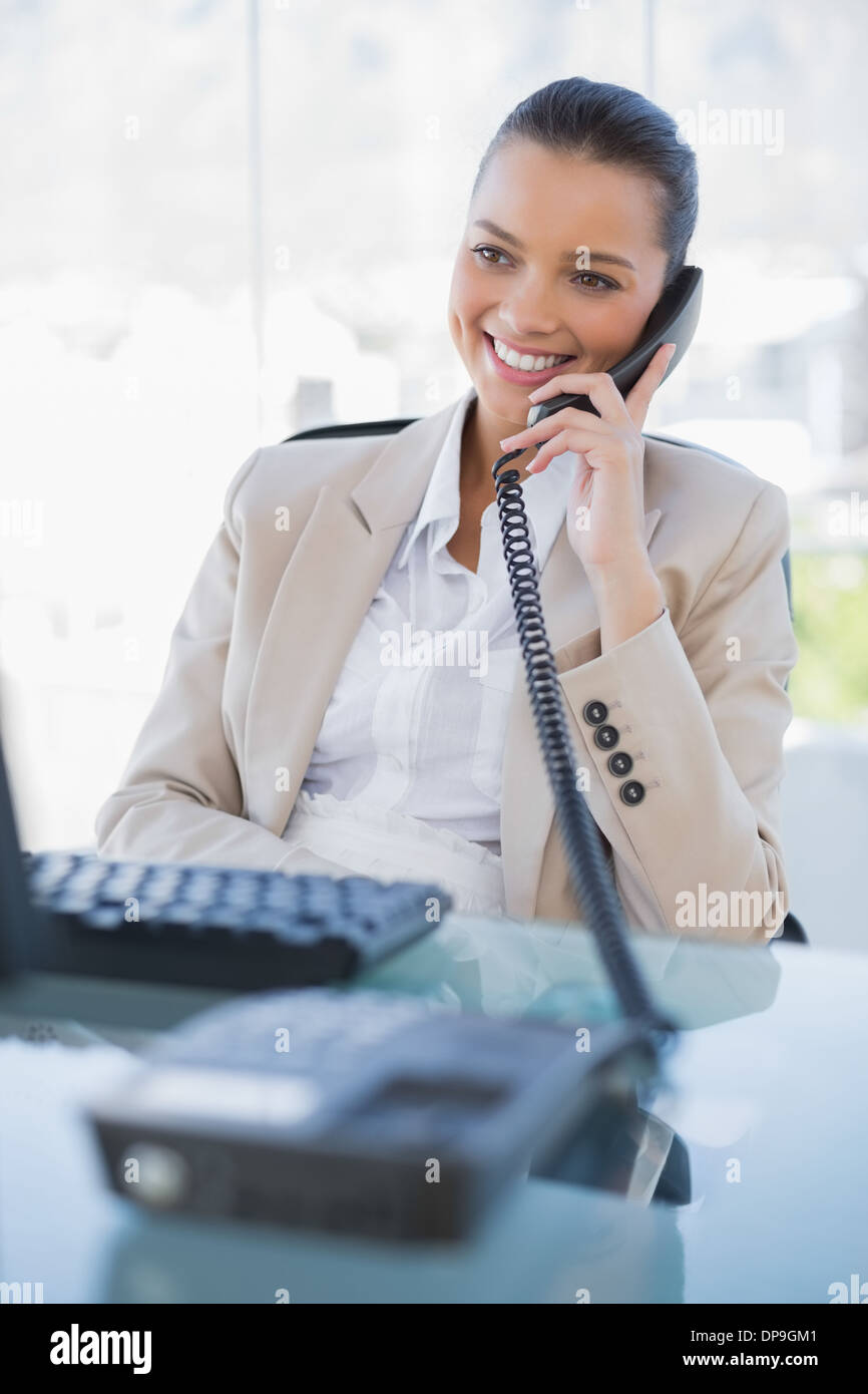 Happy gorgeous businesswoman answering the phone Stock Photo - Alamy