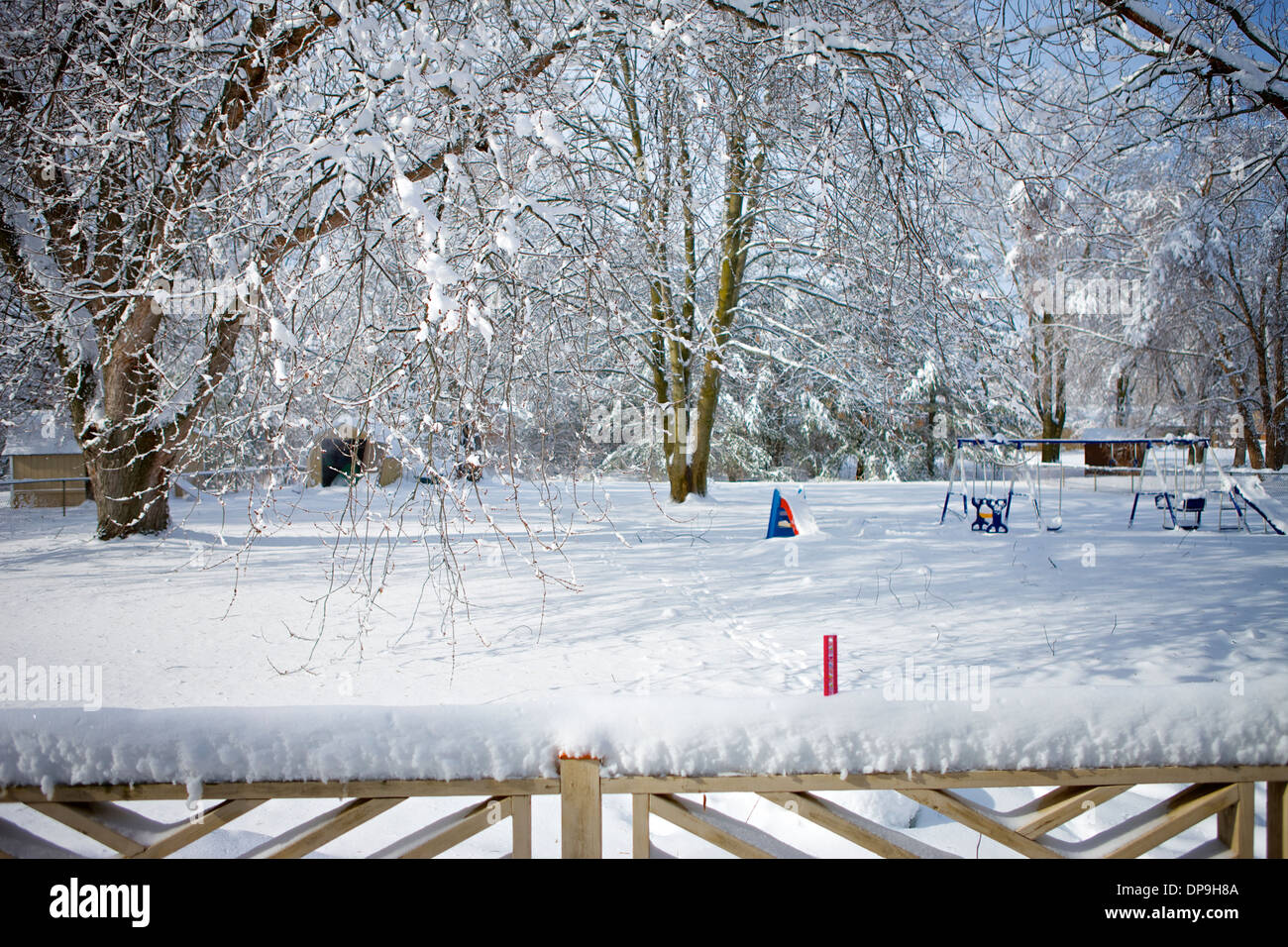 Snow storm in the midwest dumps several inches of snow in the backyard ...