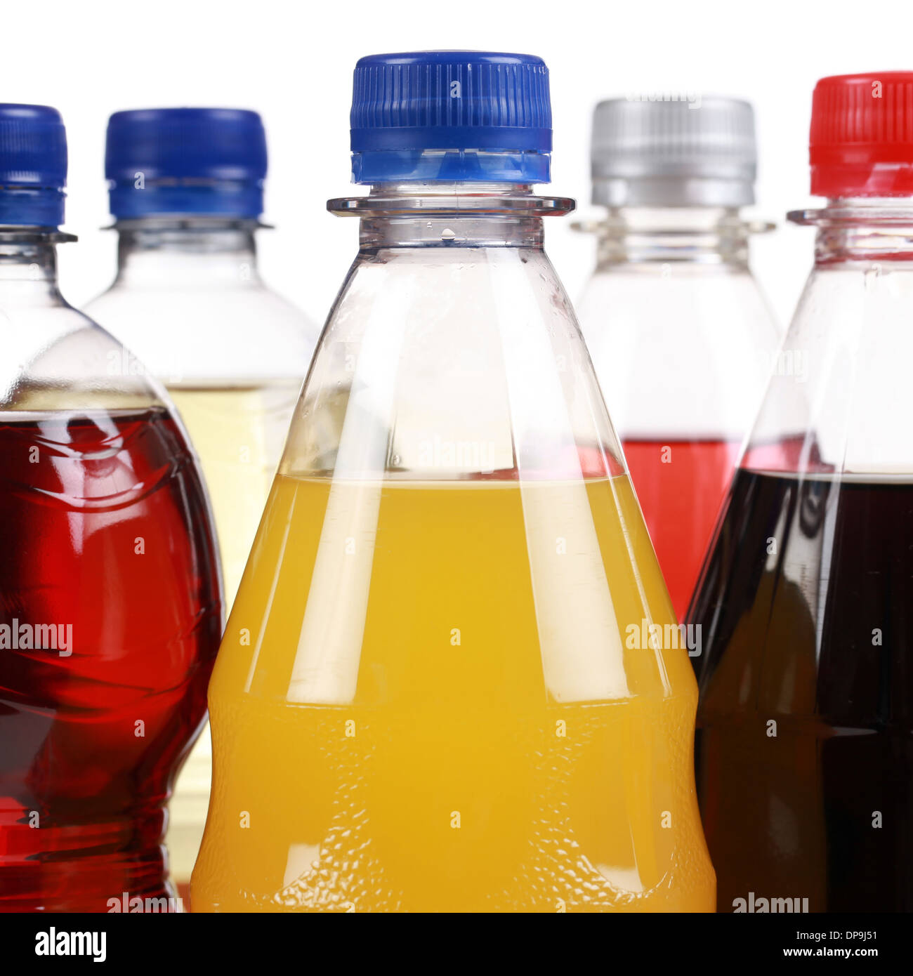 Bottles with soda drinks like cola and orange lemonade, isolated on a ...