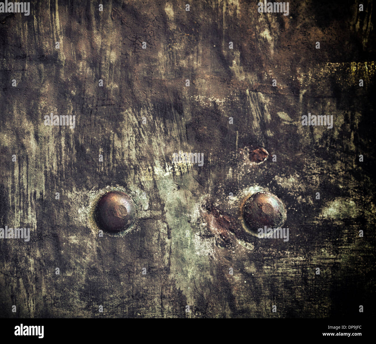 Closeup of grunge gray grey metal plate with rivets and screws as ...