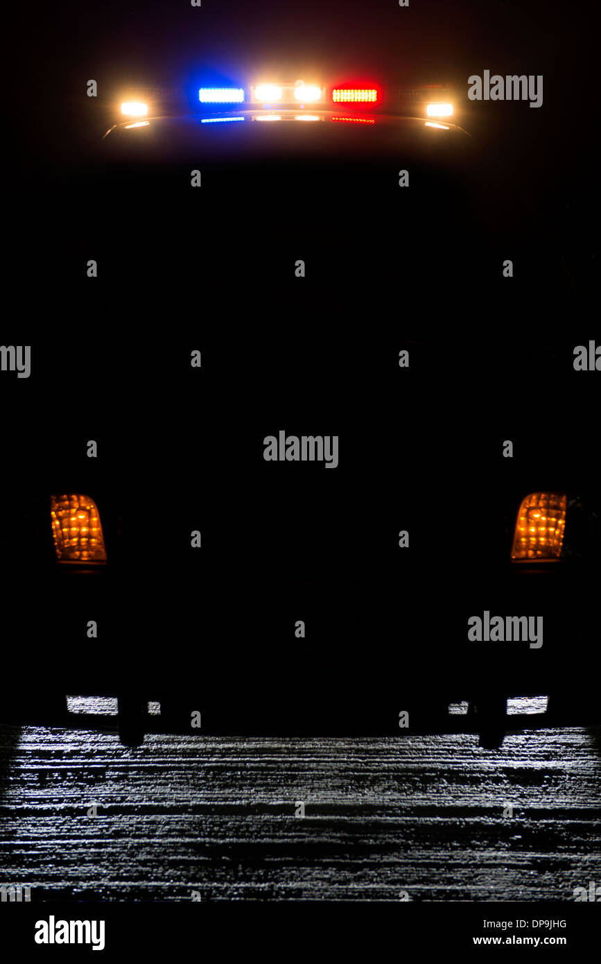 A police car at night with its lights on Stock Photo - Alamy