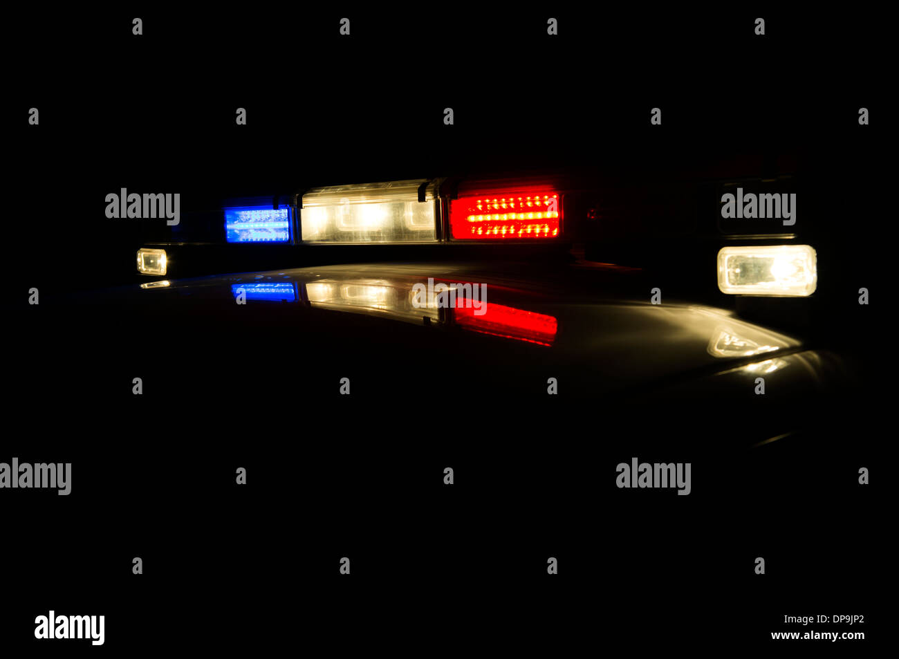 A police car at night with its lights on Stock Photo - Alamy