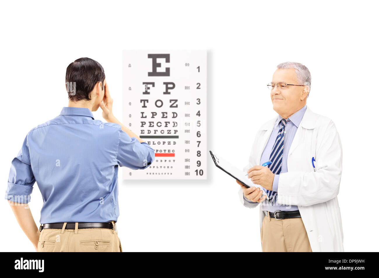 Young male patient taking eyesight test and an optician holding a ...