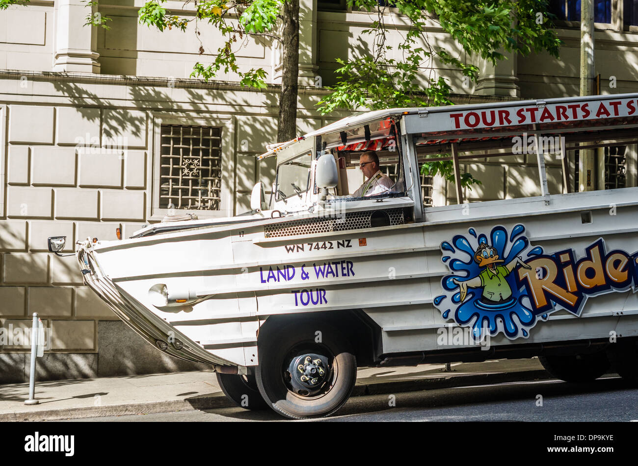 Duck tour vehicle with driver waiting to pick up tourists. Seattle ...