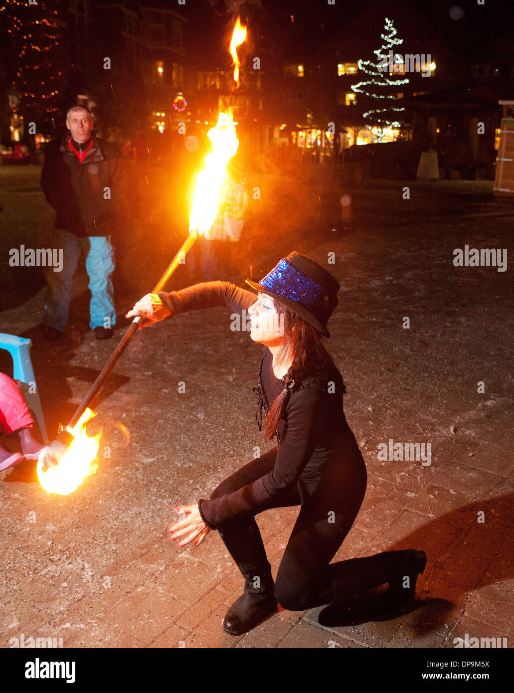 A fire spinner performs in Whistler's Olympic Plaza as part of the ...