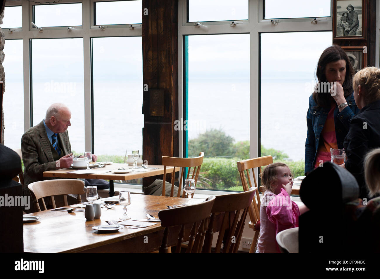 An elderly man eats alone by the window at Smugglers Creek Inn pub in ...