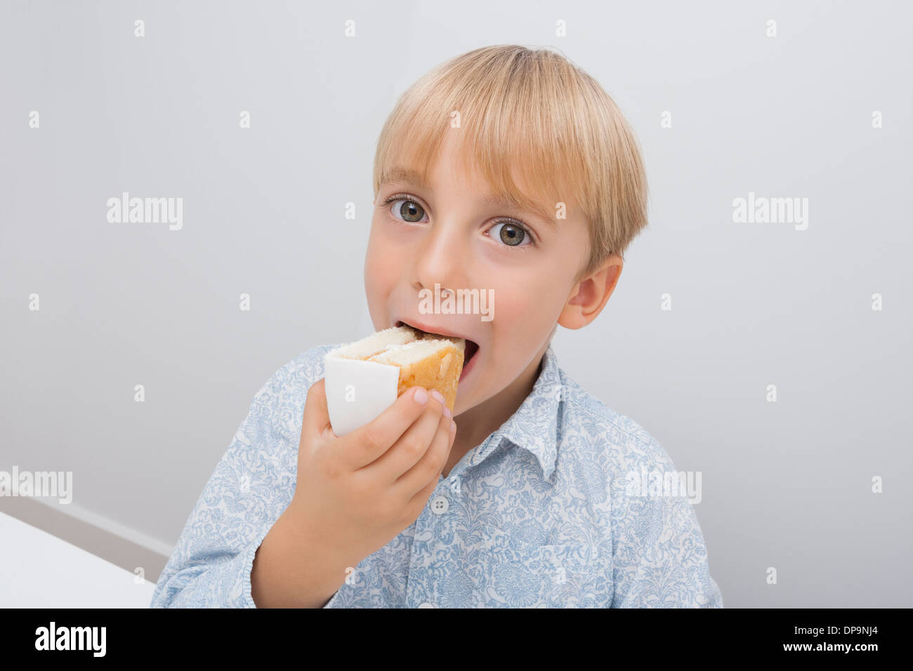 Cute boy is eating hi-res stock photography and images - Alamy