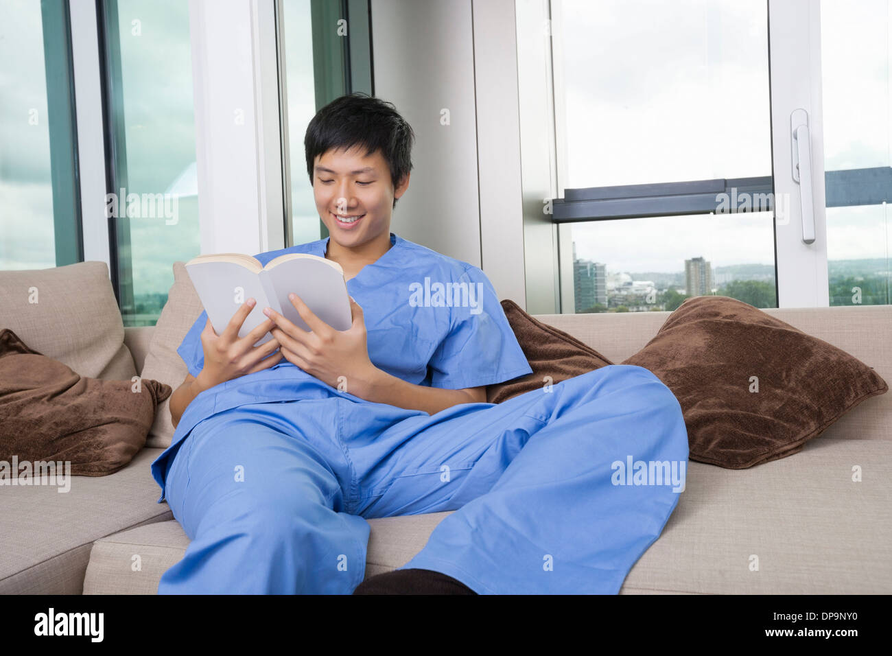 Adult male reading book hi-res stock photography and images - Alamy