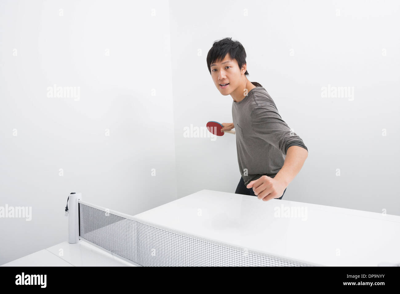 Portrait of man playing table tennis Stock Photo - Alamy