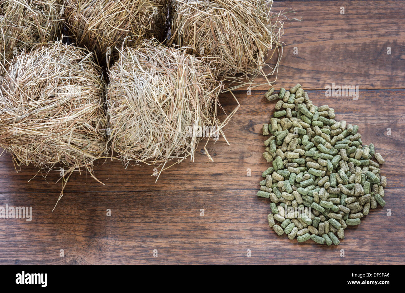 Rodent food and hay on grunge wooden background Stock Photo - Alamy