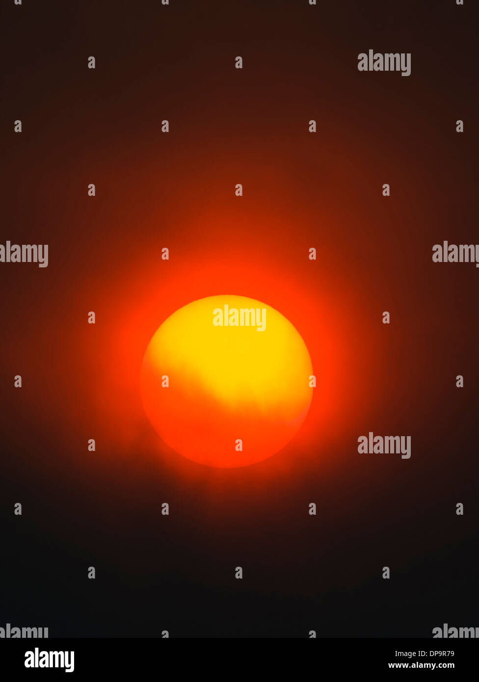 Smoke from forest fires creates an unusual eerie orange glow to the ...