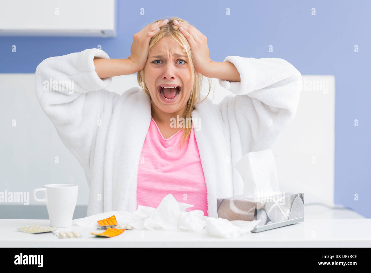 Portrait of young exhausted woman screaming while suffering from ...