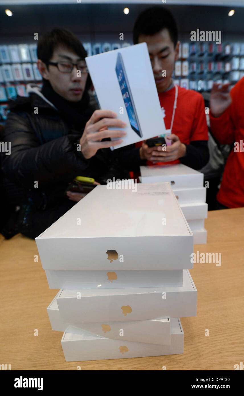 Beijing, China. 10th Jan, 2014. A customer selects products at the new ...