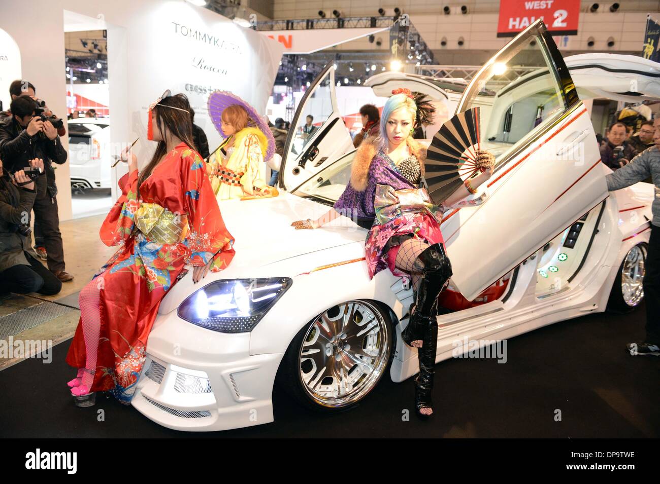 Tokyo, Japan. 10th Jan, 2014. Models presnt a modified car at the Tokyo ...