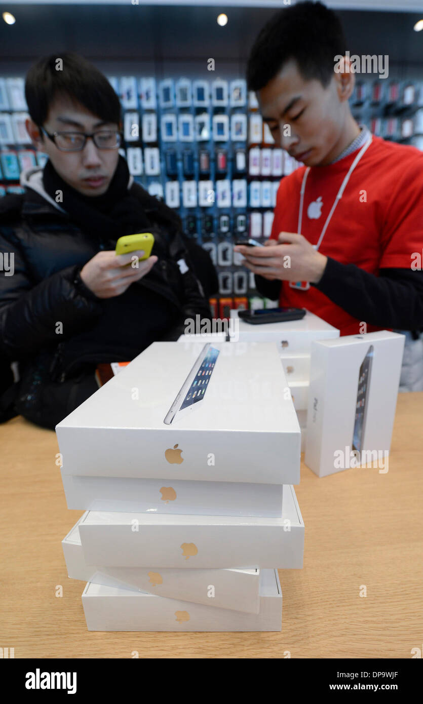 Beijing, China. 10th Jan, 2014. A customer selects products at the new ...