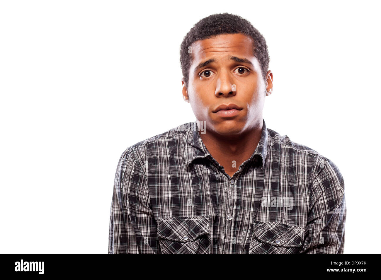 dark-skinned young man posing with a sad expression on white Stock ...