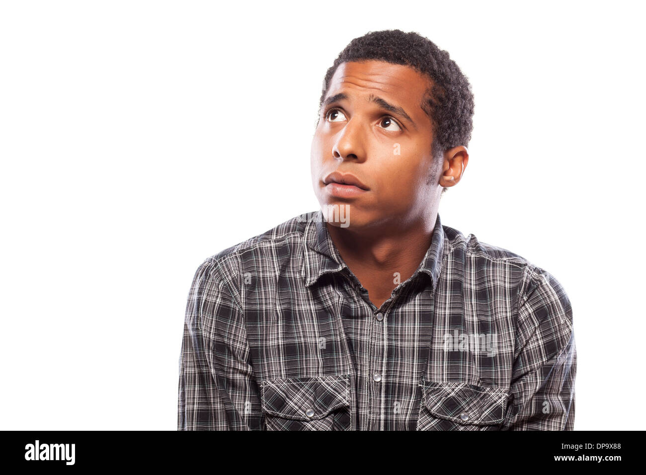 dark-skinned young man posing with a sad expression on white Stock ...
