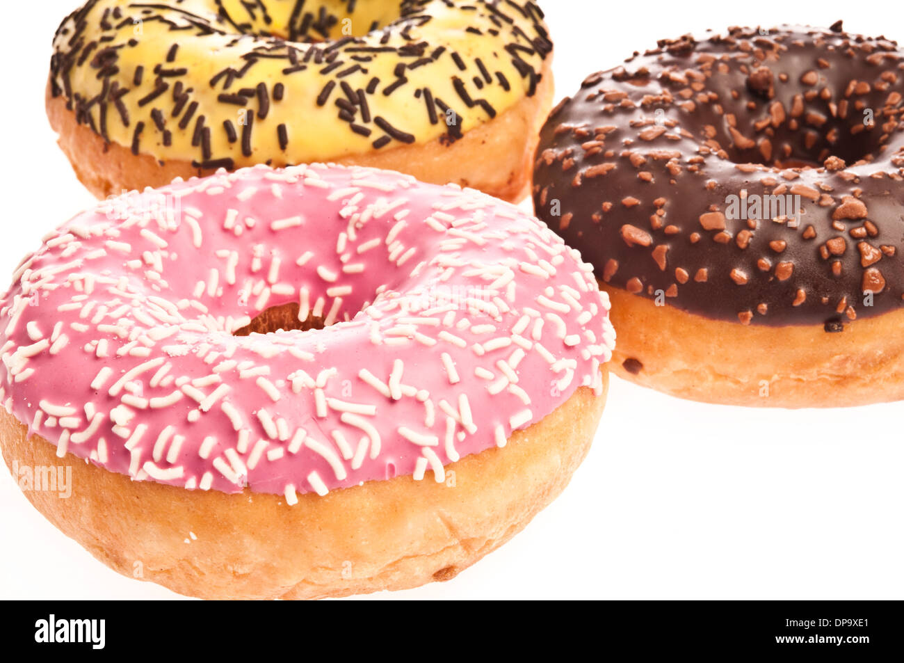 three frosted doughnuts Stock Photo - Alamy