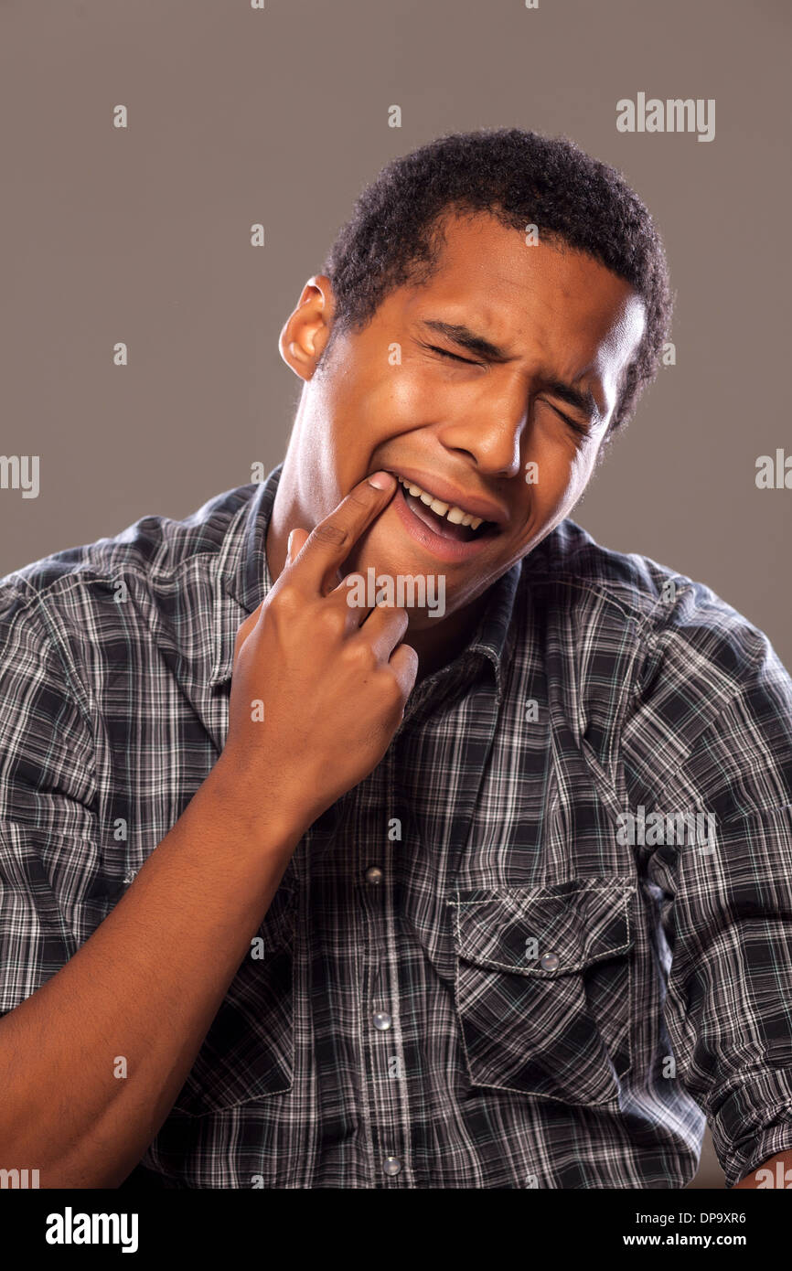 young African American young man with a strong toothache Stock Photo ...