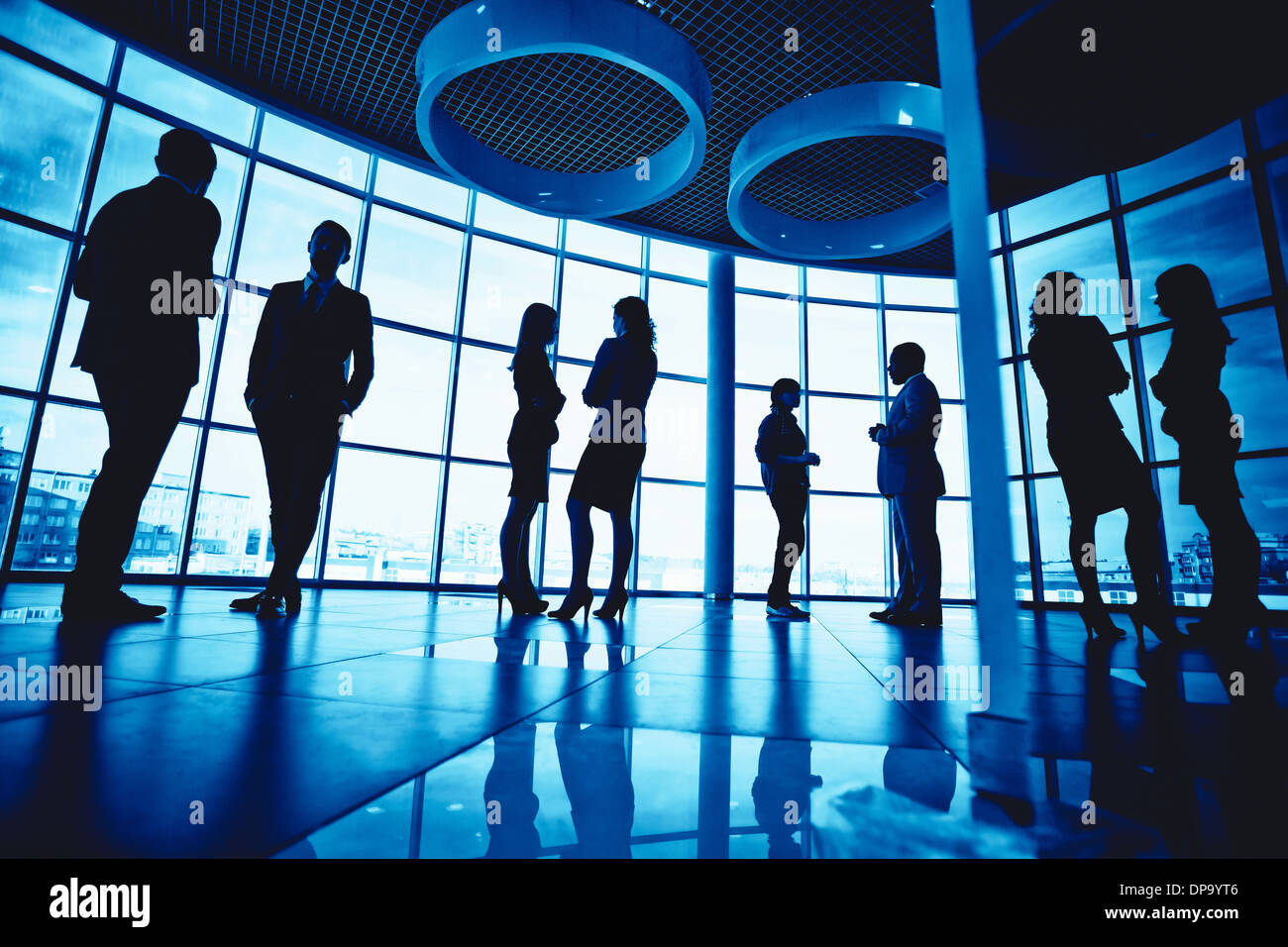 Four pairs of white collar workers communicating in office Stock Photo ...