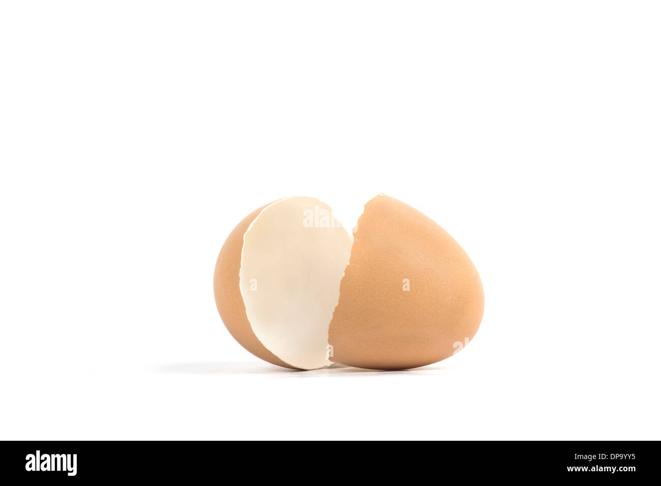 Egg shell crack isolated on white background Stock Photo - Alamy