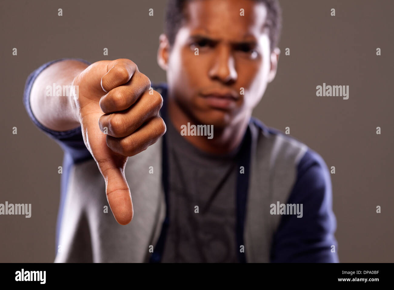 African man showing thumbs down hi-res stock photography and images - Alamy