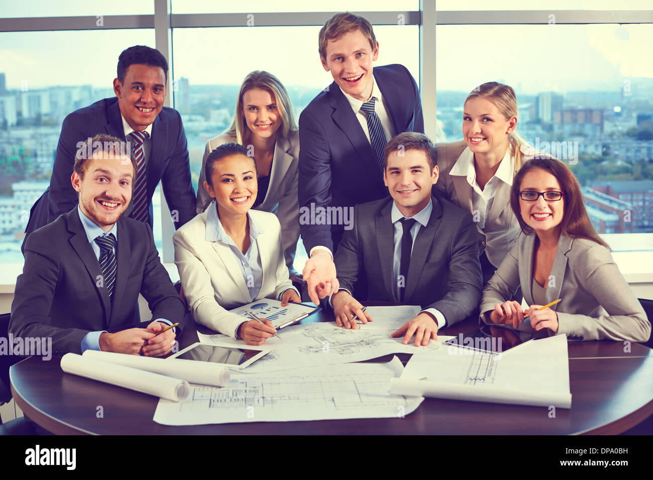 Group of business partners looking at camera with smiles in office ...