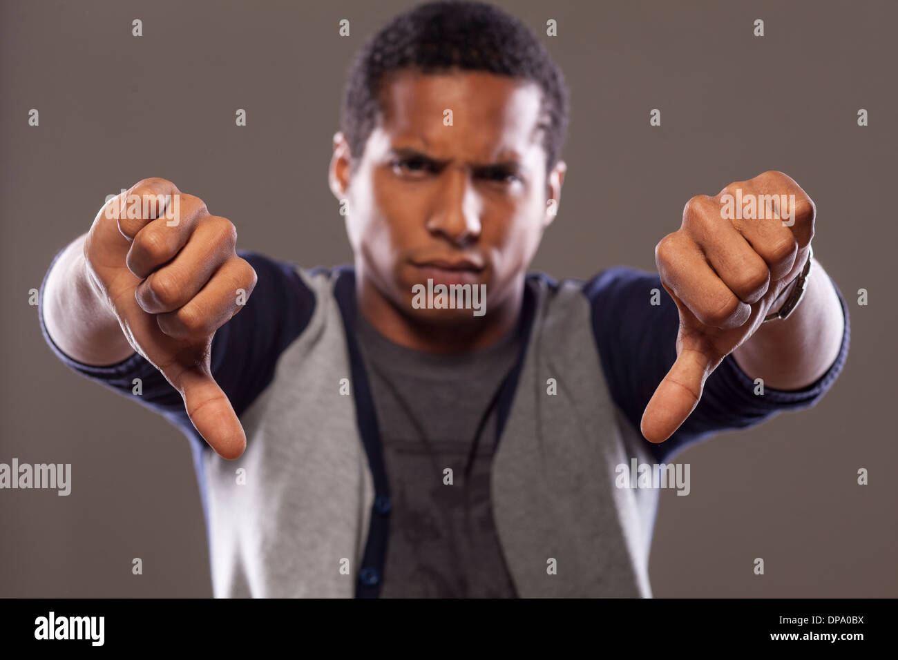 African man showing thumbs down hi-res stock photography and images - Alamy