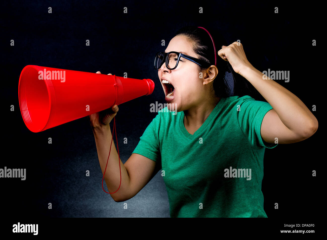 asian woman yelling shooting in studio Stock Photo - Alamy