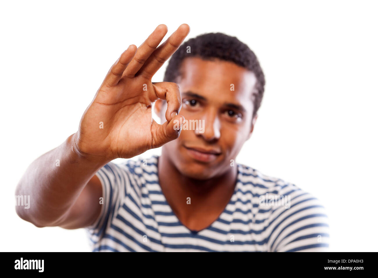 dark-skinned young man make a finger sign for delicious Stock Photo - Alamy