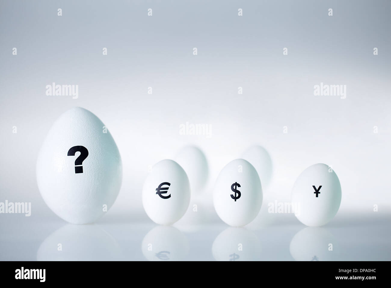 Close-up of big egg with question mark on it and several small eggs ...