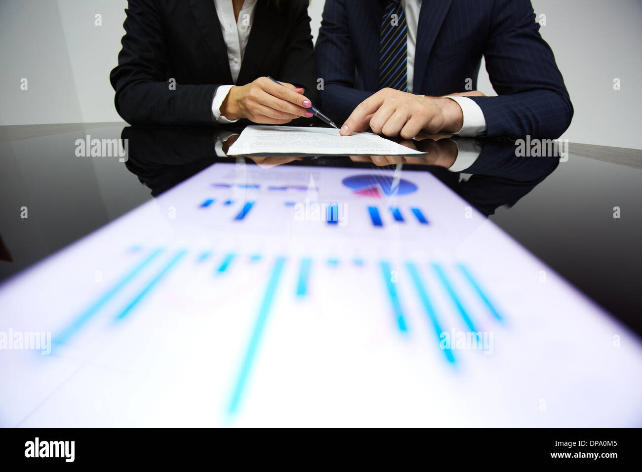 Image of human hands during reading contract Stock Photo - Alamy