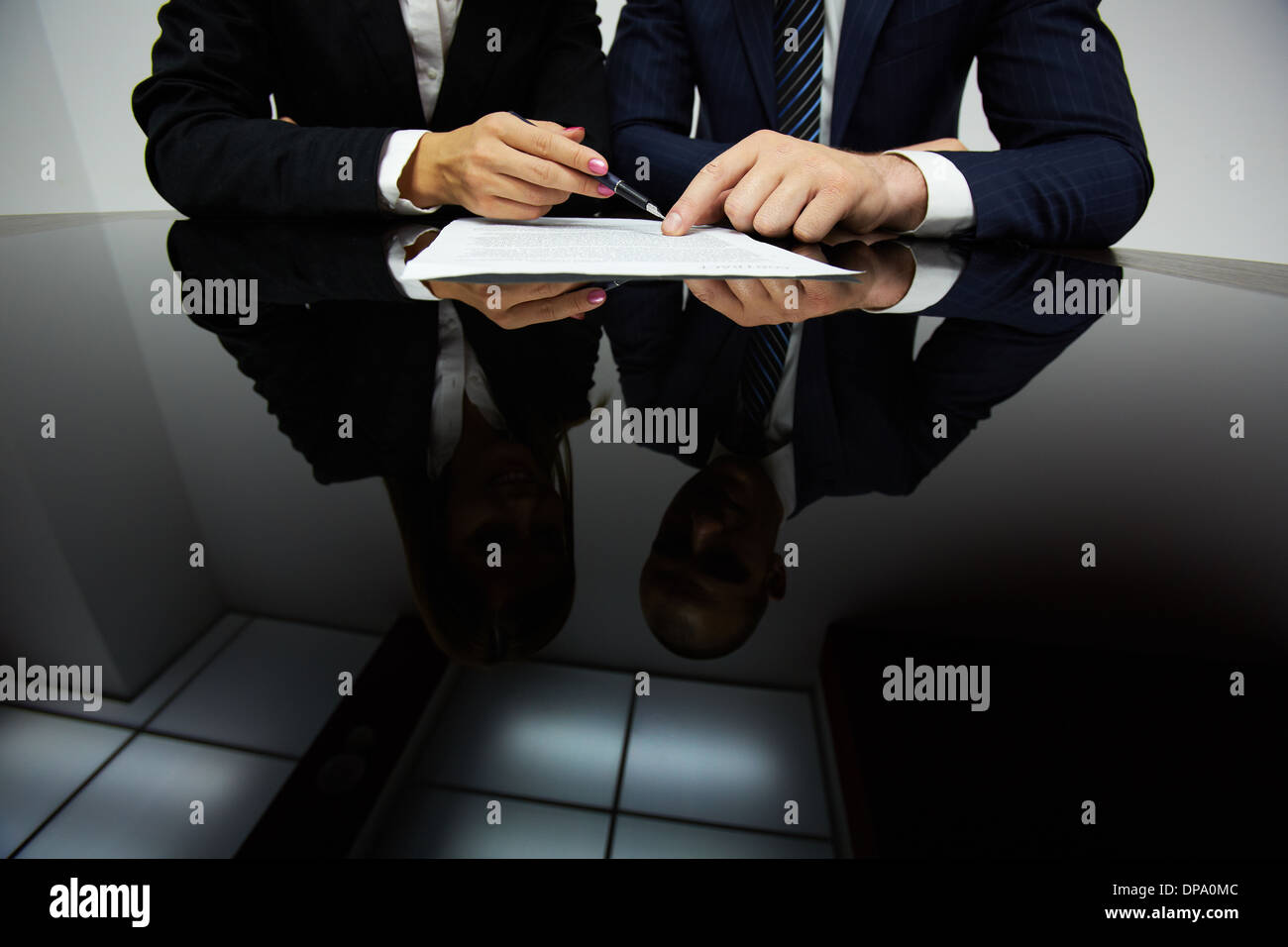 Image of human hands during reading contract Stock Photo - Alamy