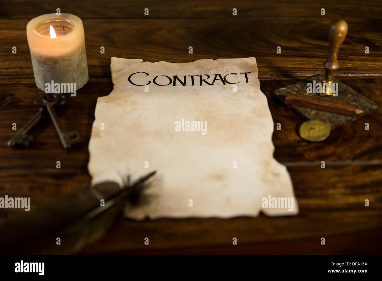 an old parchment with the word Contract Stock Photo - Alamy