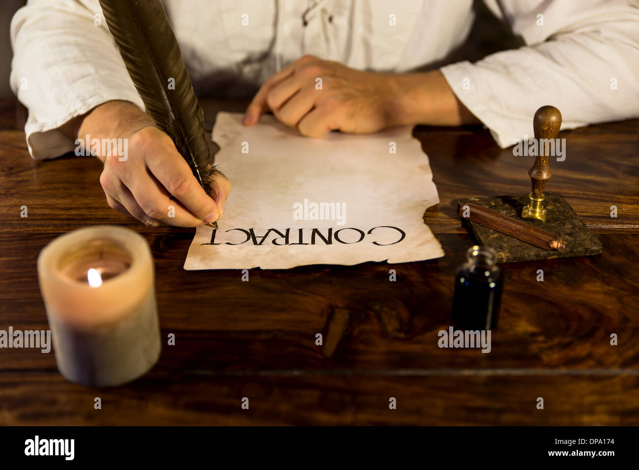 medieval man writes a contract Stock Photo - Alamy