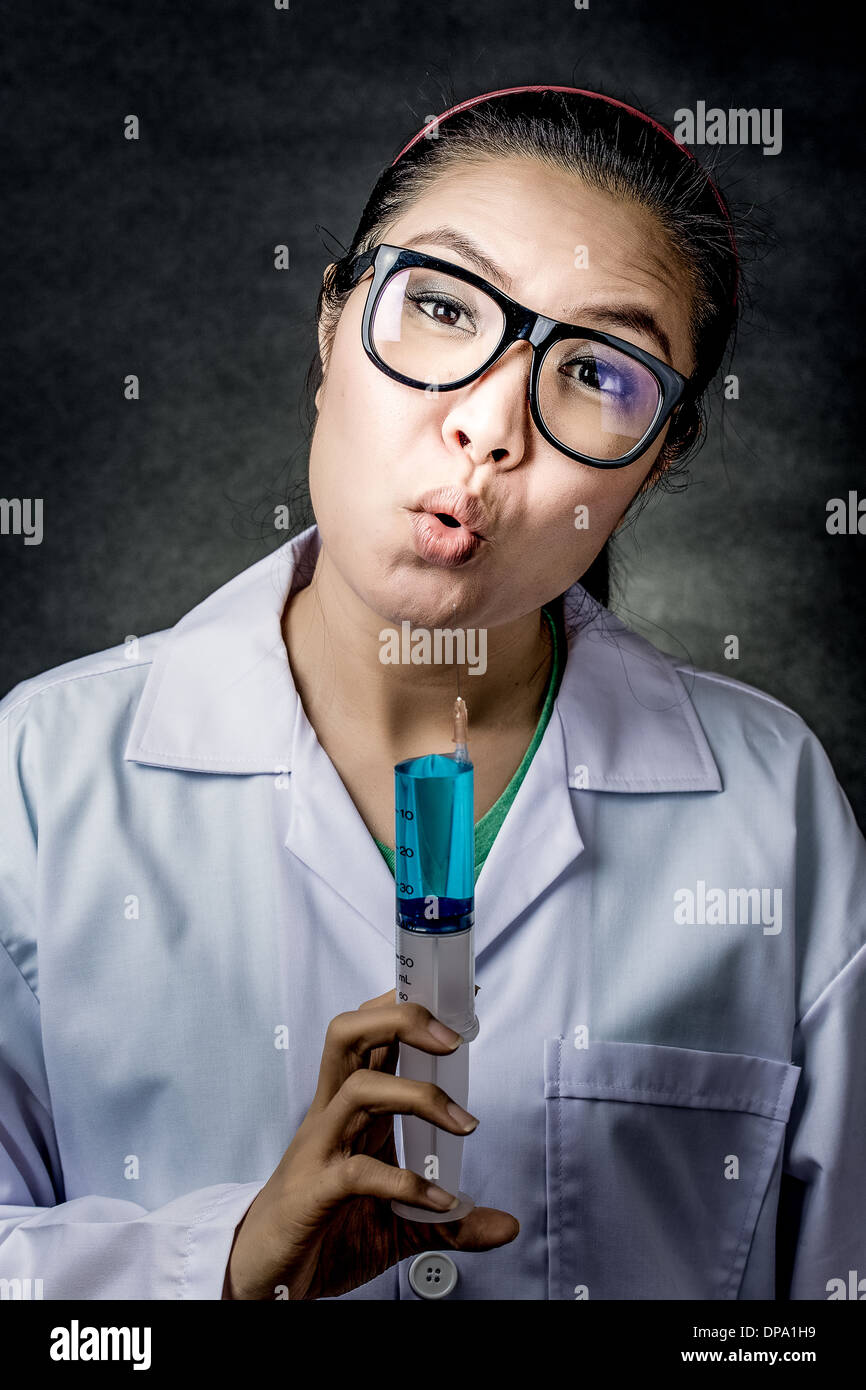 Asian female doctor shooting in studio Stock Photo - Alamy