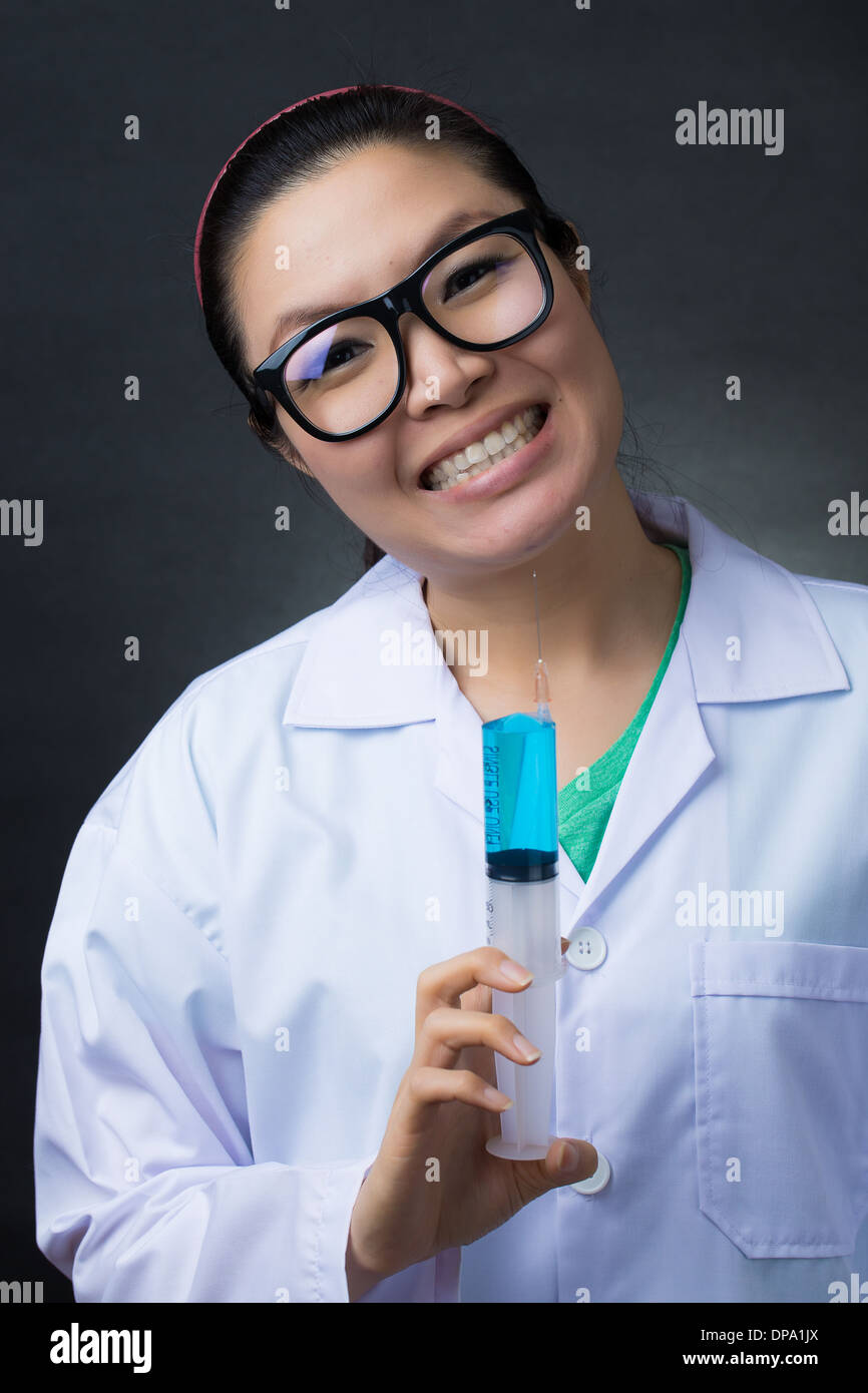 Asian female doctor shooting in studio Stock Photo - Alamy