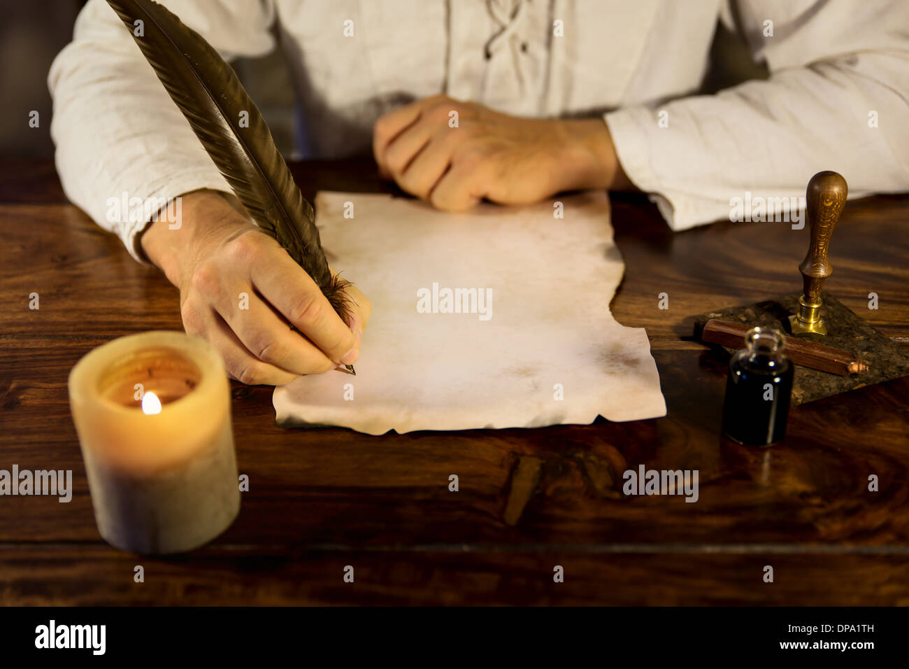 man writing on a old parchment Stock Photo - Alamy