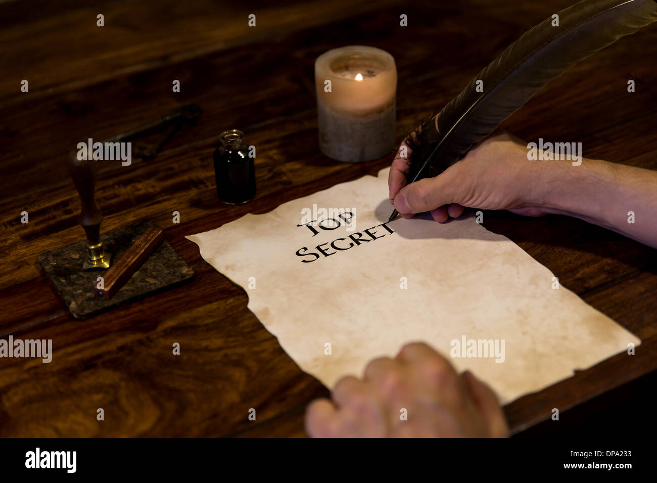 Man is writing on a paper Top Secret Stock Photo - Alamy