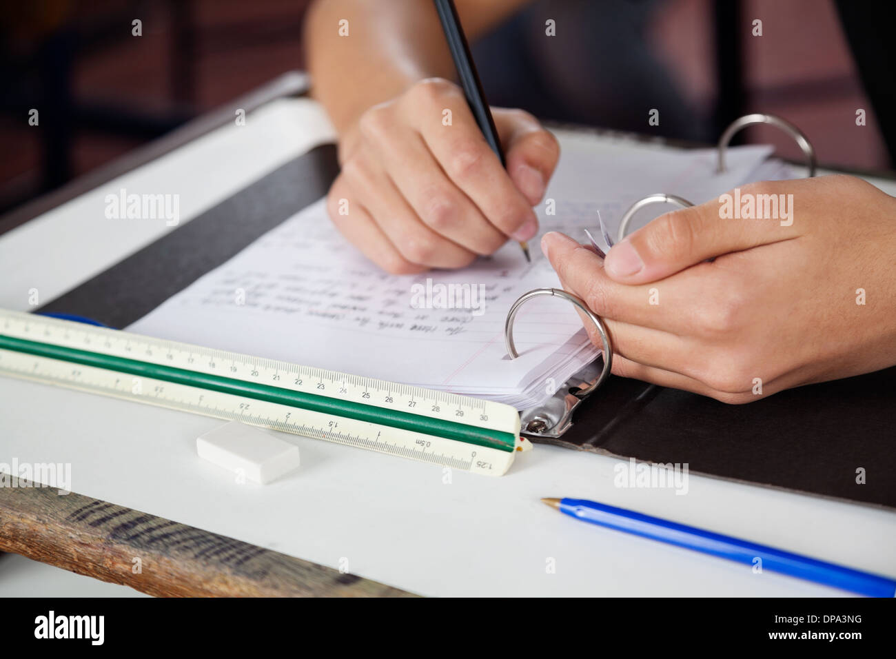 Schoolboy Copying At Desk During Examination Stock Photo - Alamy