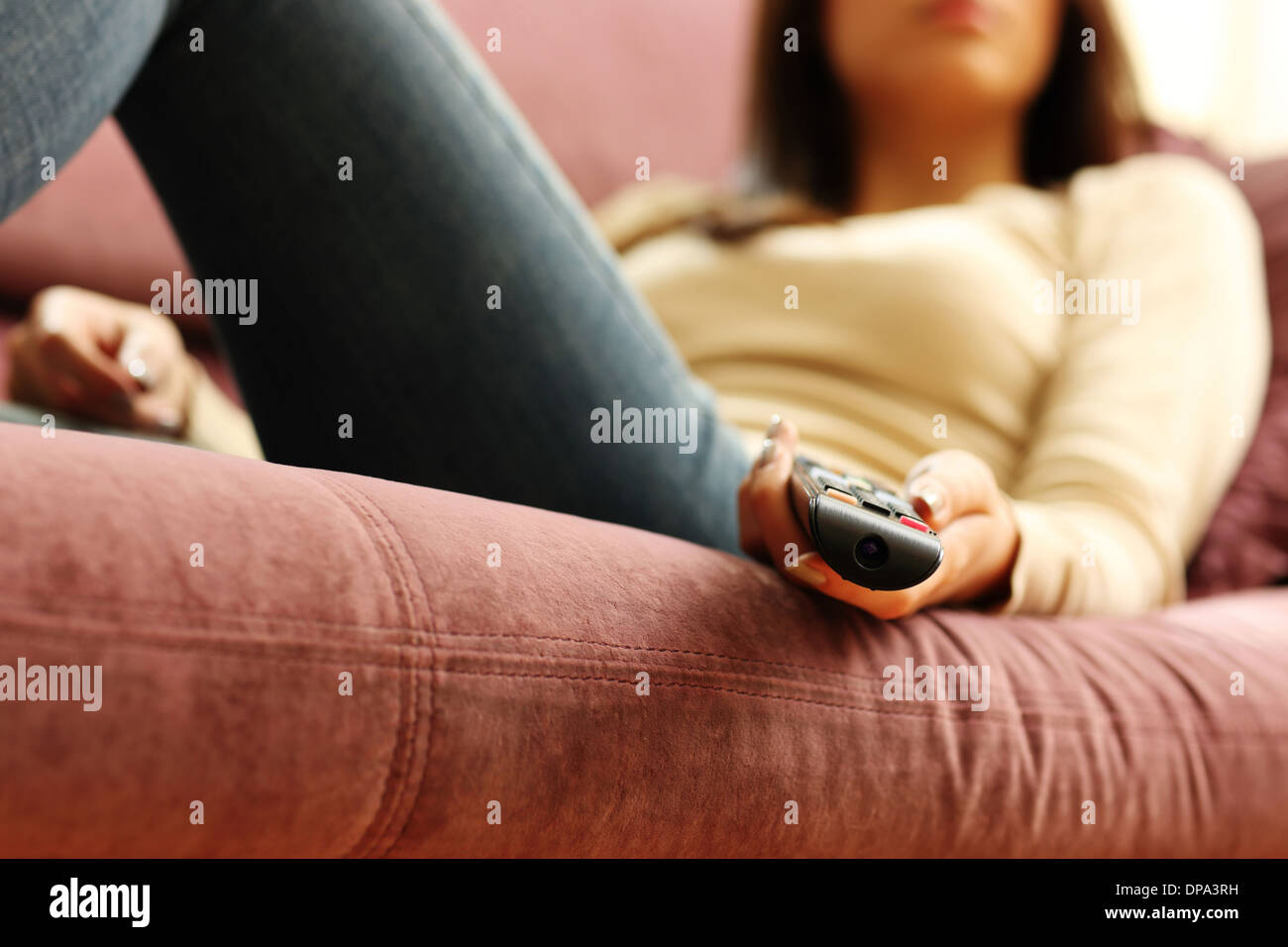 Closeup image of a female hand holding remote control Stock Photo - Alamy