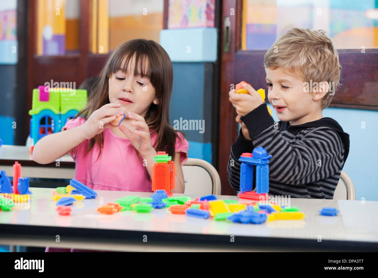 Children Playing With Blocks In Classroom Stock Photo - Alamy