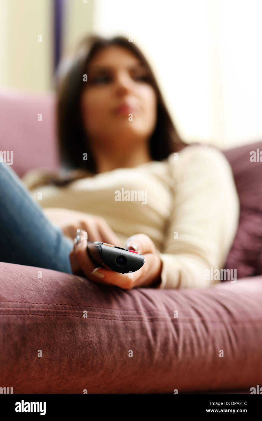 Closeup image of a female hand holding remote control Stock Photo - Alamy