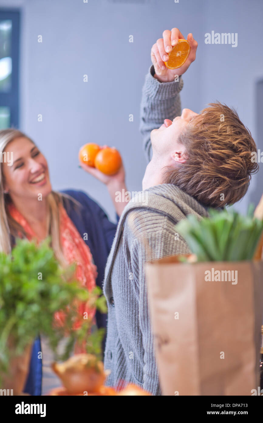 Young couple messing around in kitchen Stock Photo - Alamy