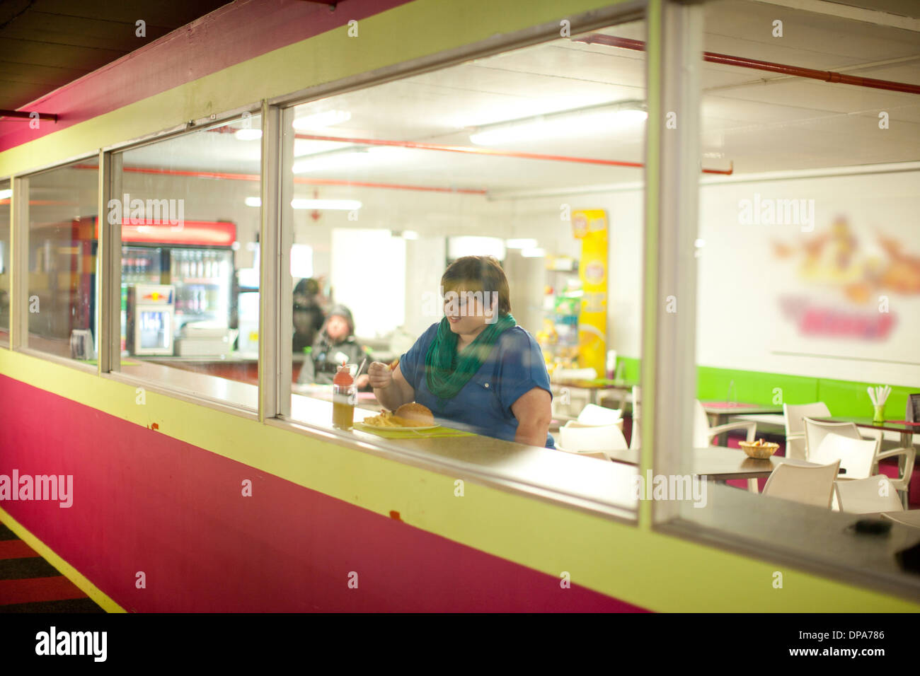 Woman sitting window seat eating lunch hi-res stock photography and ...