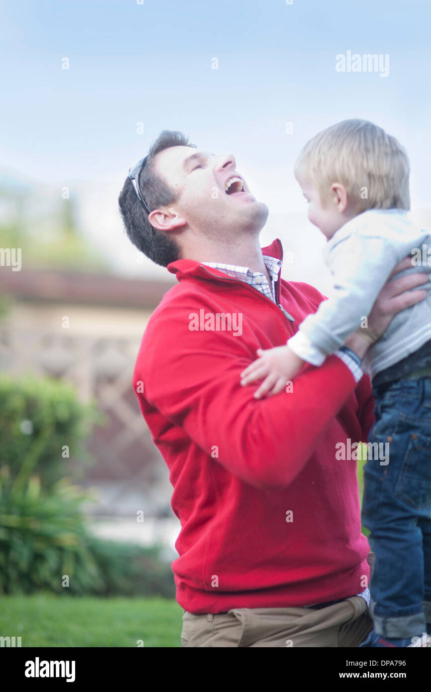 Father lifting toddler Stock Photo - Alamy