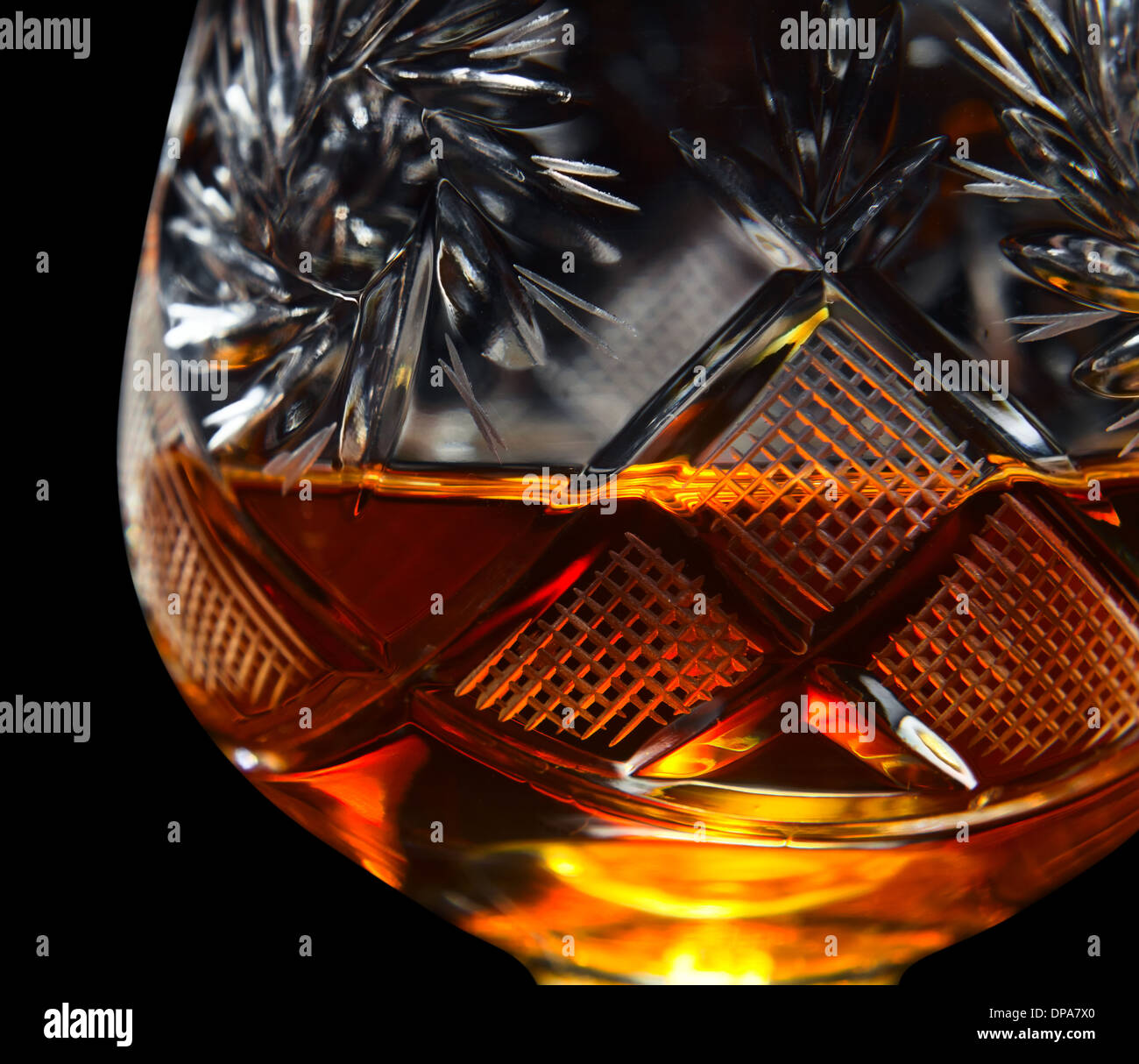 old snifter with brandy , isolated in black , saved clipping path Stock ...