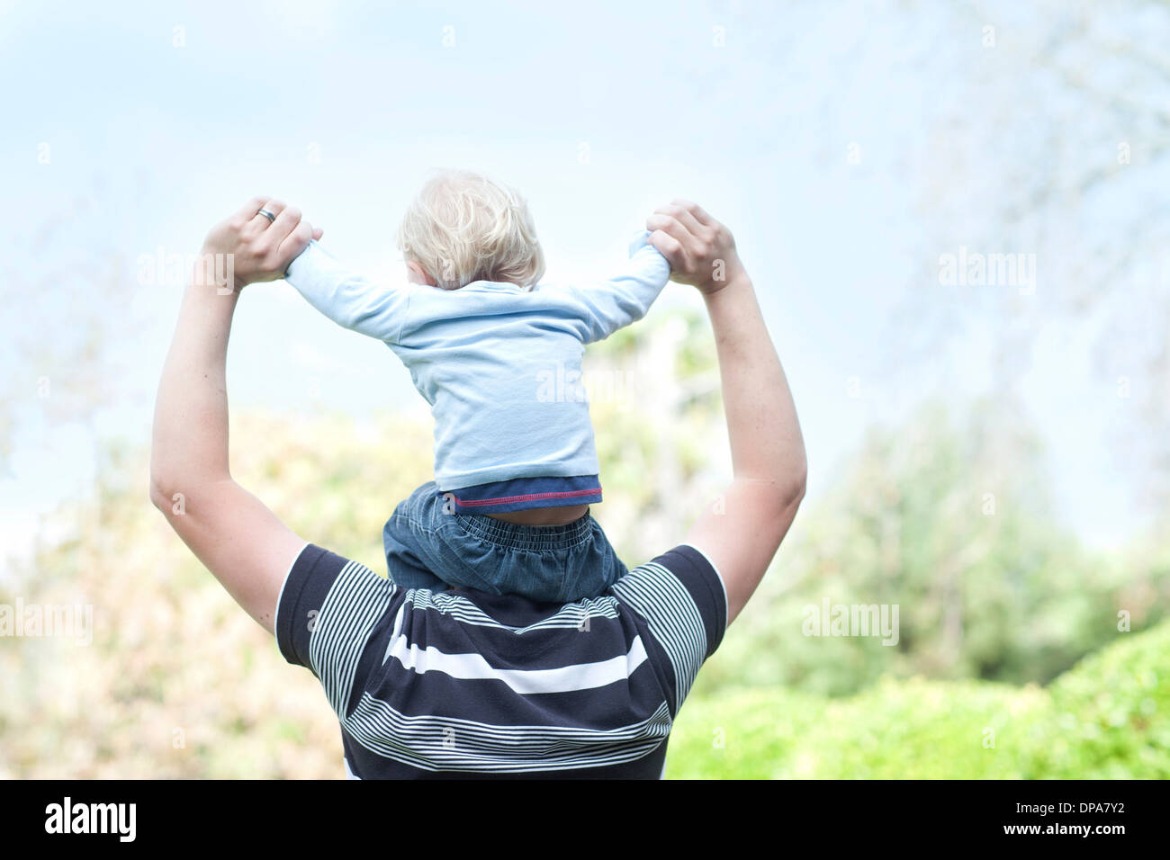 Father carrying son on shoulder hi-res stock photography and images - Alamy