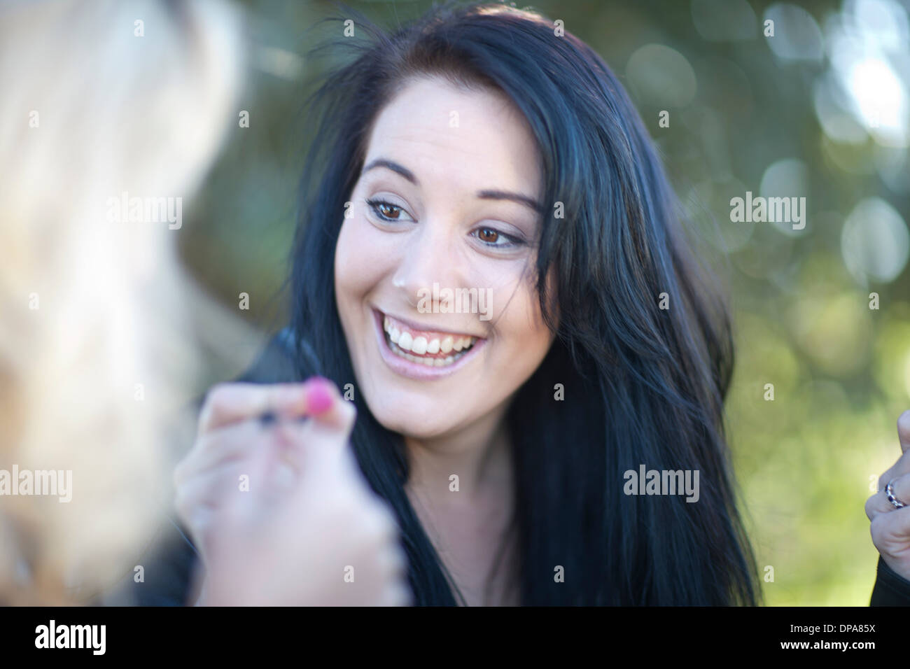 Group of young females sharing sweets Stock Photo - Alamy